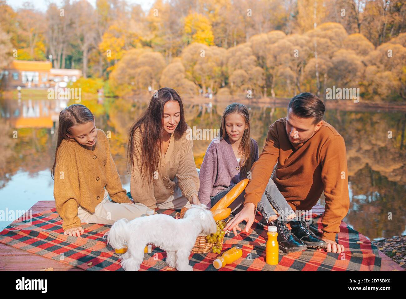 Portrait of happy family in autumn day Stock Photo - Alamy