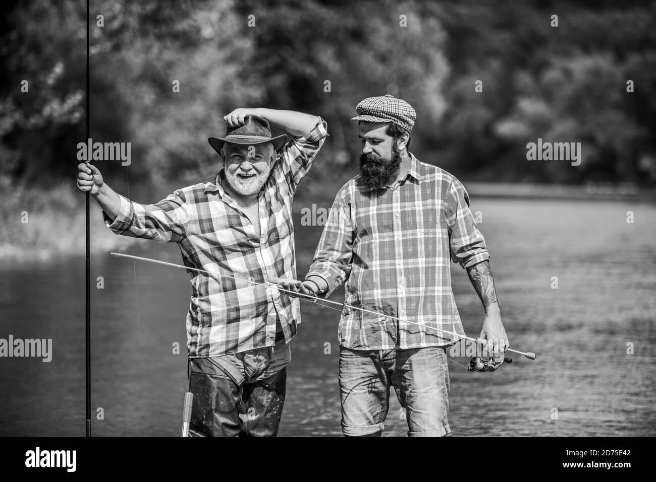 we are as One. Big game fishing. male friendship. two happy fisherman ...