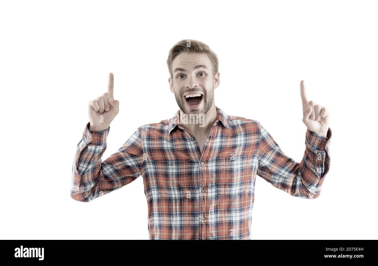 Check it out. Look there. Man pointing at copy space. Man muscular ...