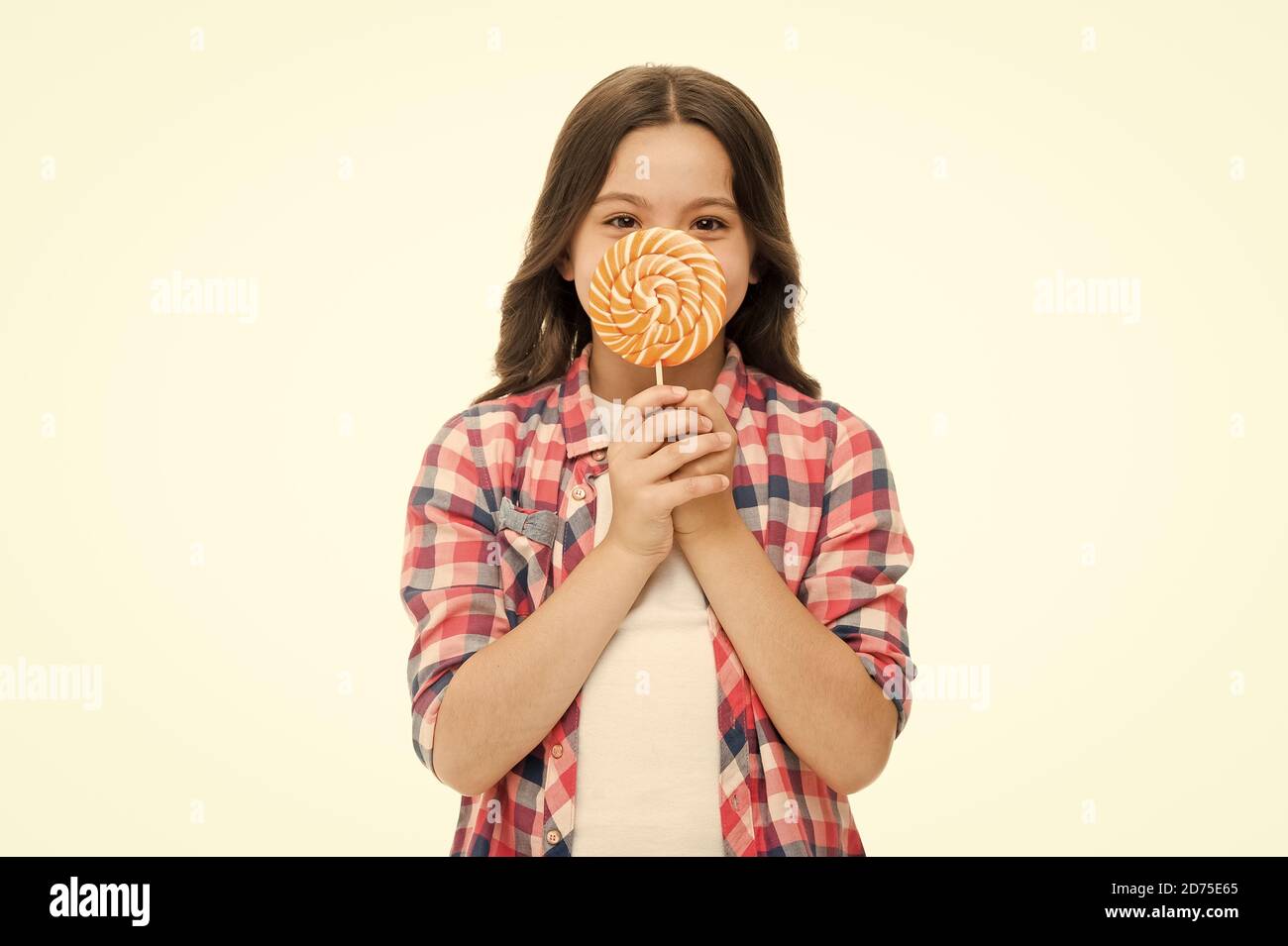 Food addictions. Girl kid eat sweet lollipop. Happy childhood. Sugar ...