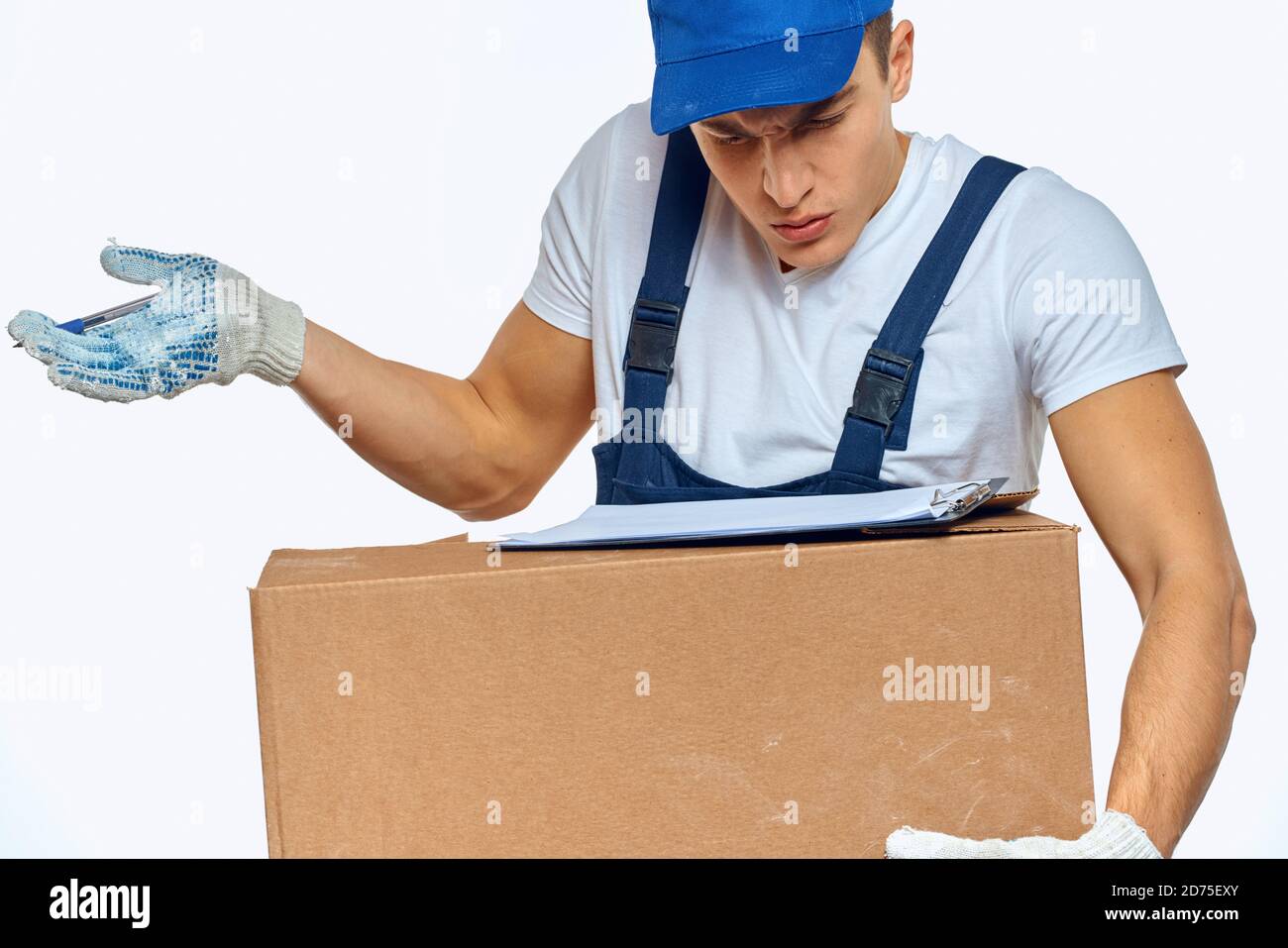 Man worker with box in hands delivery loading service work light ...