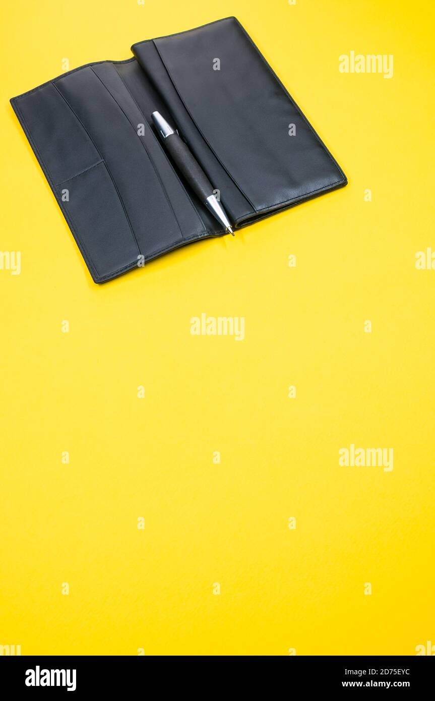 Closeup of a rollerball pen inside a small leather wallet Stock Photo ...