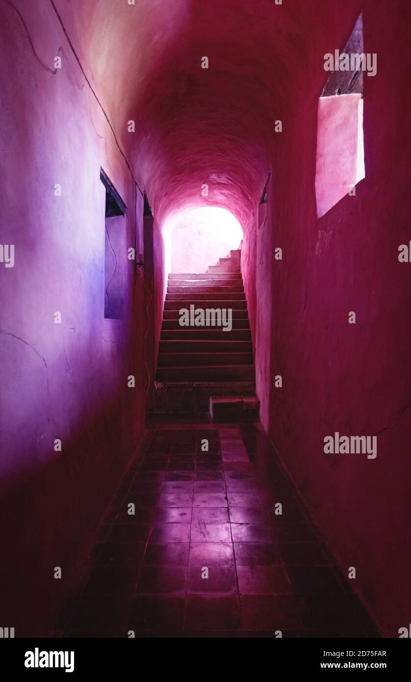 Pink orange colored corridor and staircase of the former monestary ...