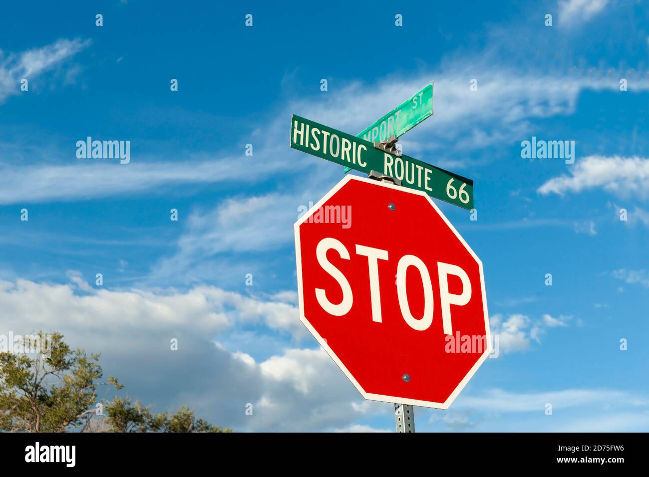 Red stop road sign with Historic Route 66 above with blue and cloudy ...