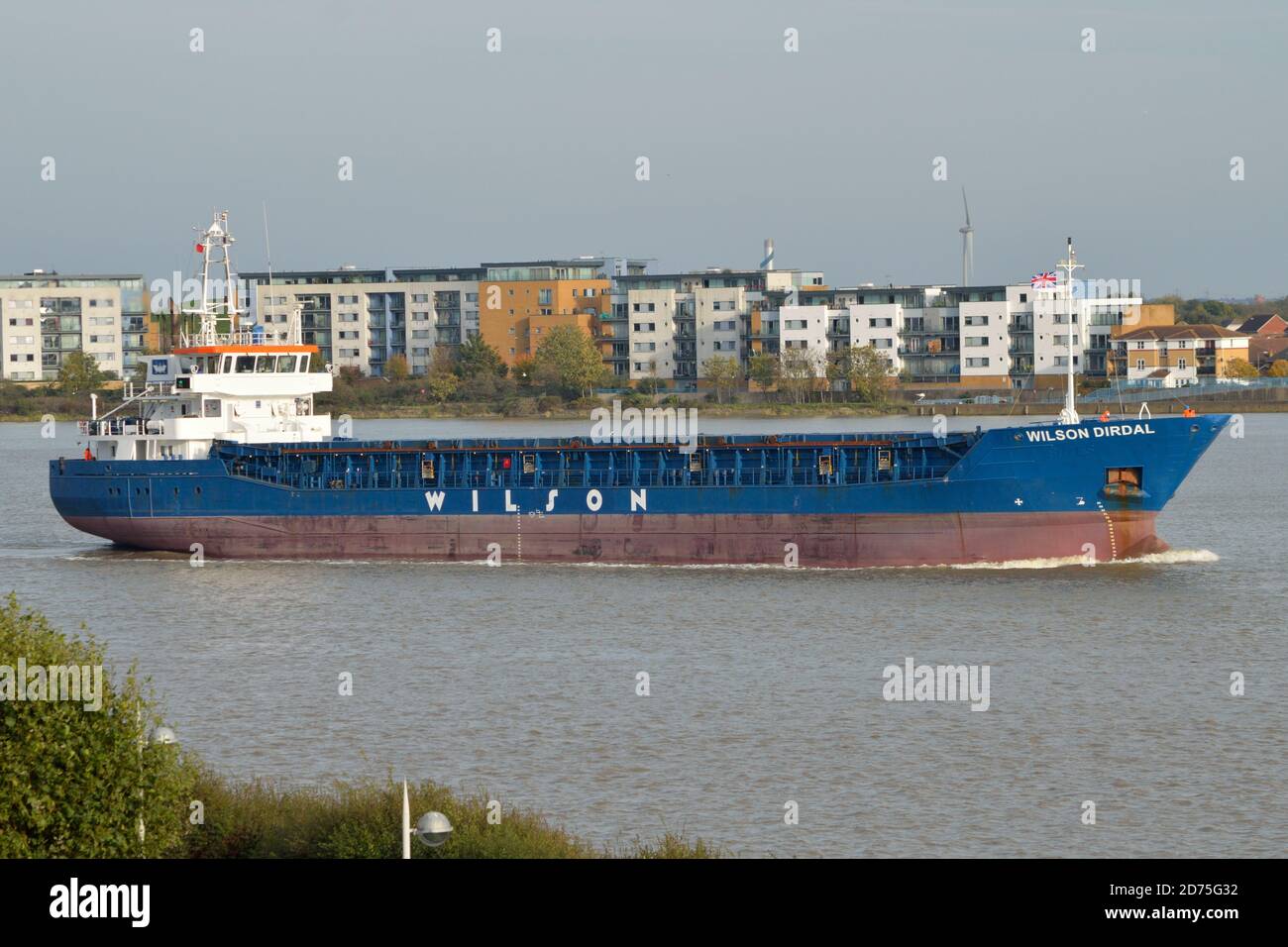 Cargo ship Wilson Dirdal arrives on the River Thames to collect a cargo ...