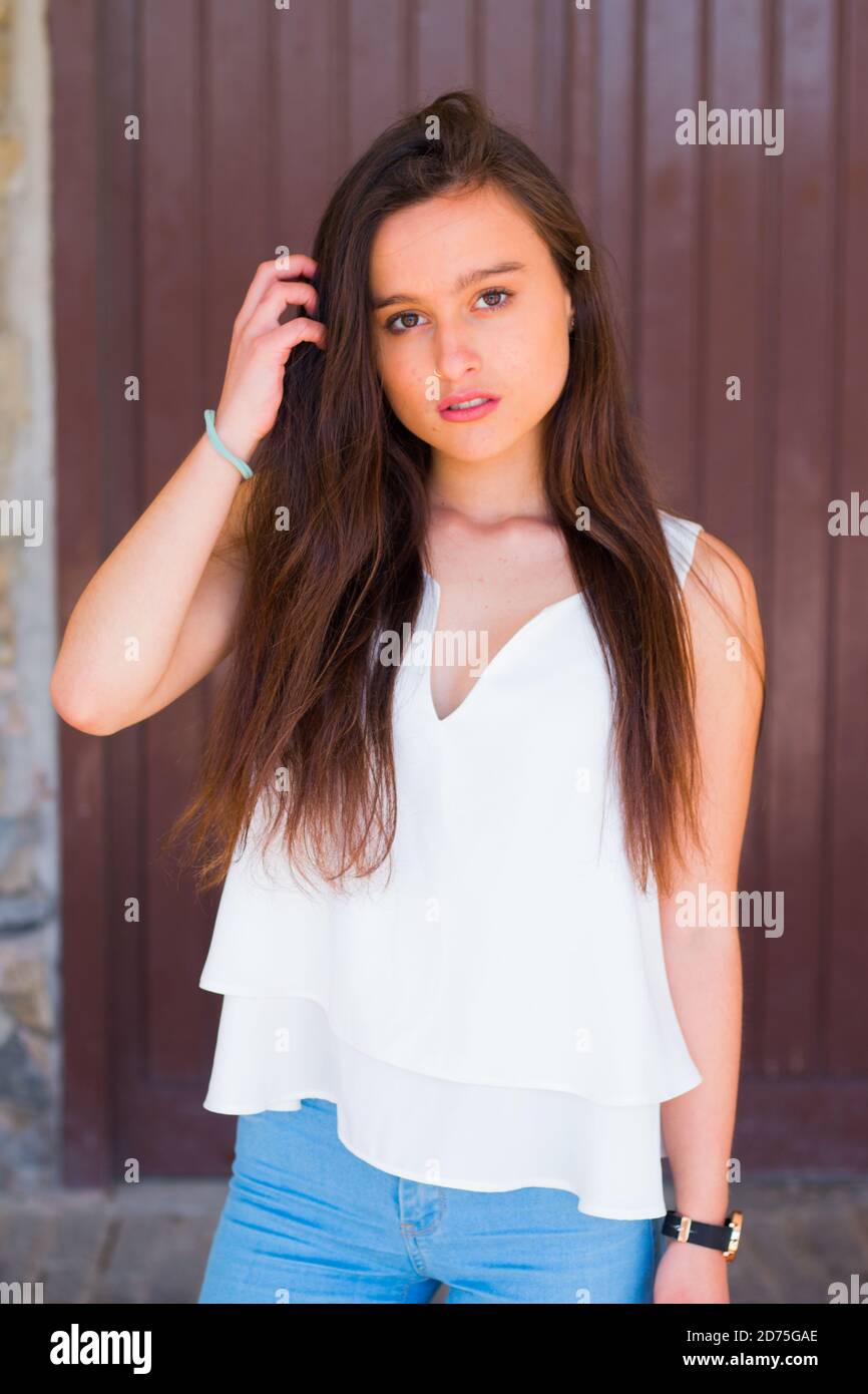 Young caucasian girl walking through Donostia-San Sebastian, basque ...