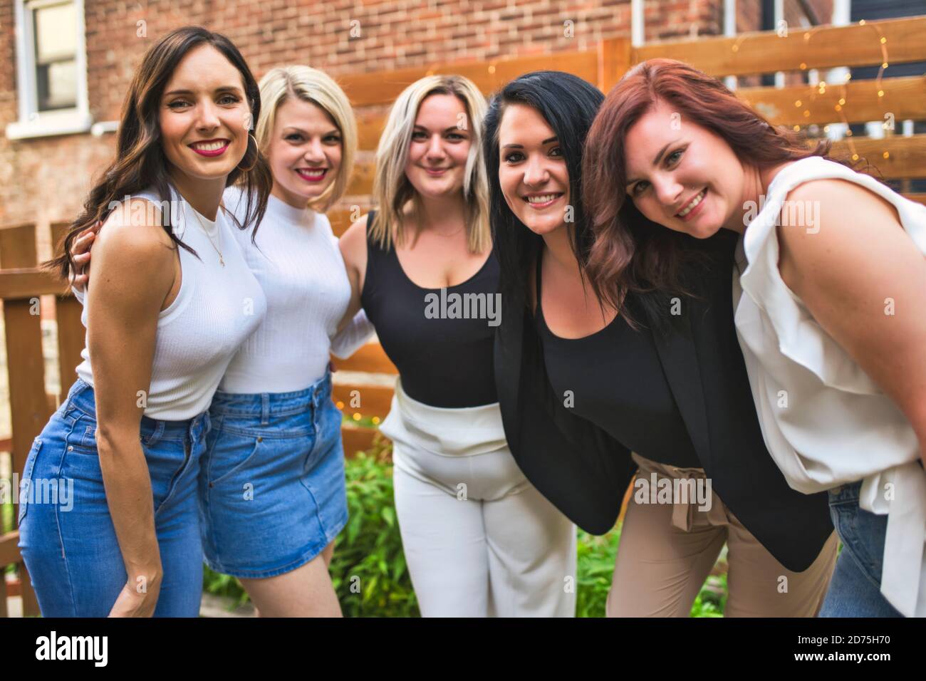 Group of girls friends having good time together in the backyard Stock ...