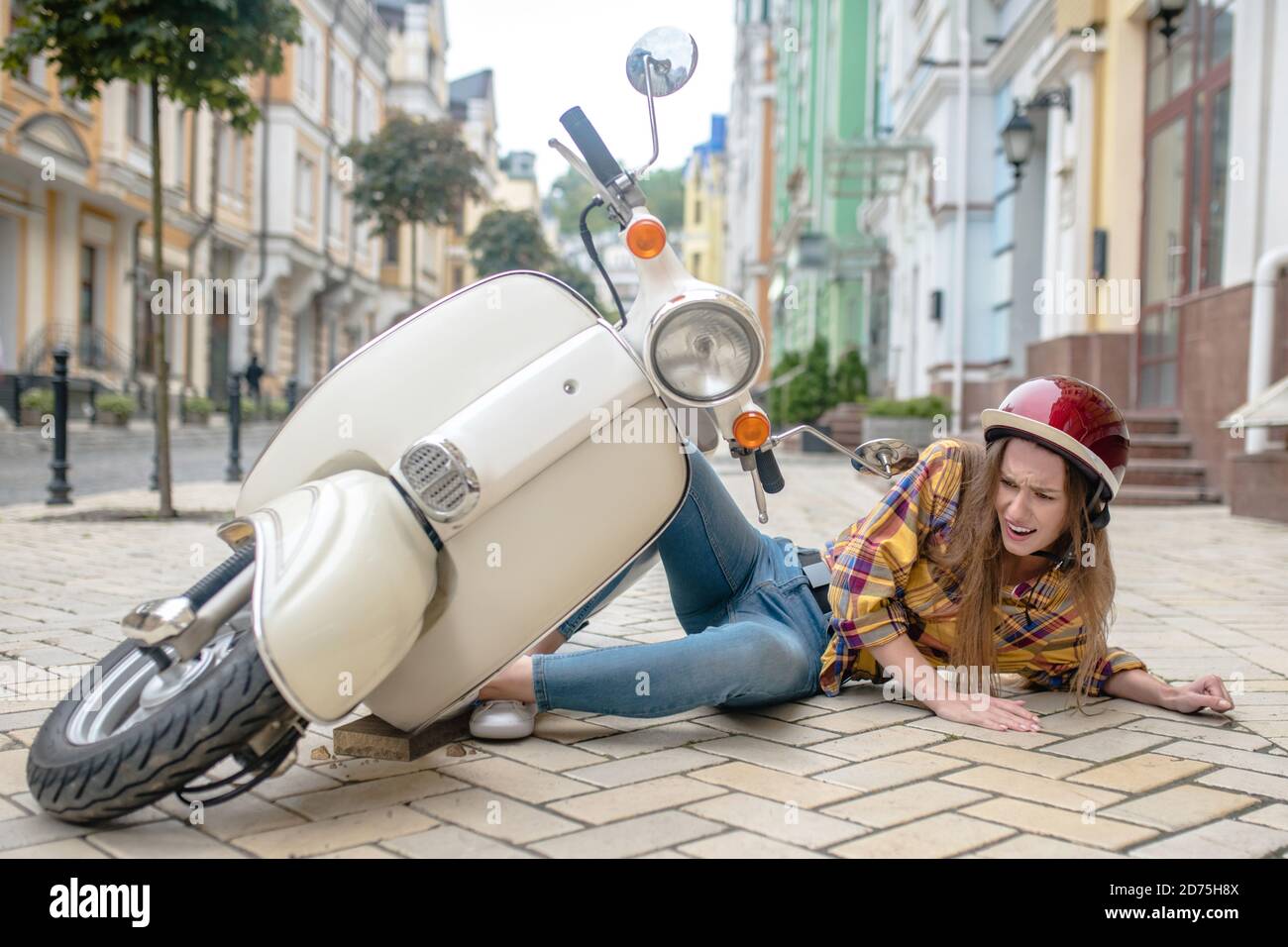 Woman falling from the scooter while having a first ride Stock Photo ...