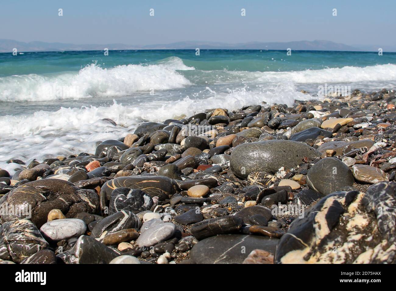 Mesmerizing shot of pebble beaches of the Aegean Sea on the island of ...