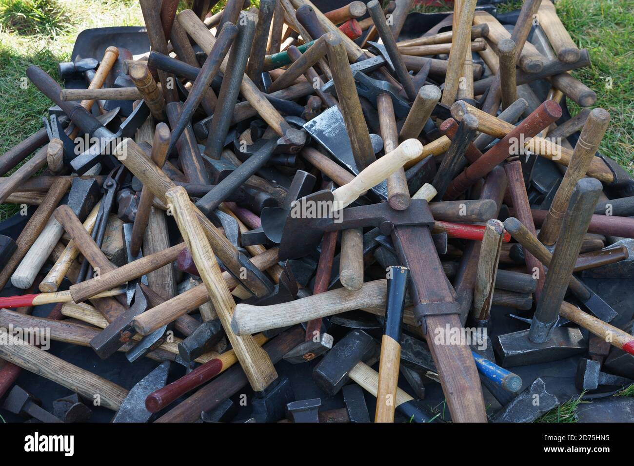 A pile of construction tools - axes and hammers. Background Stock Photo ...