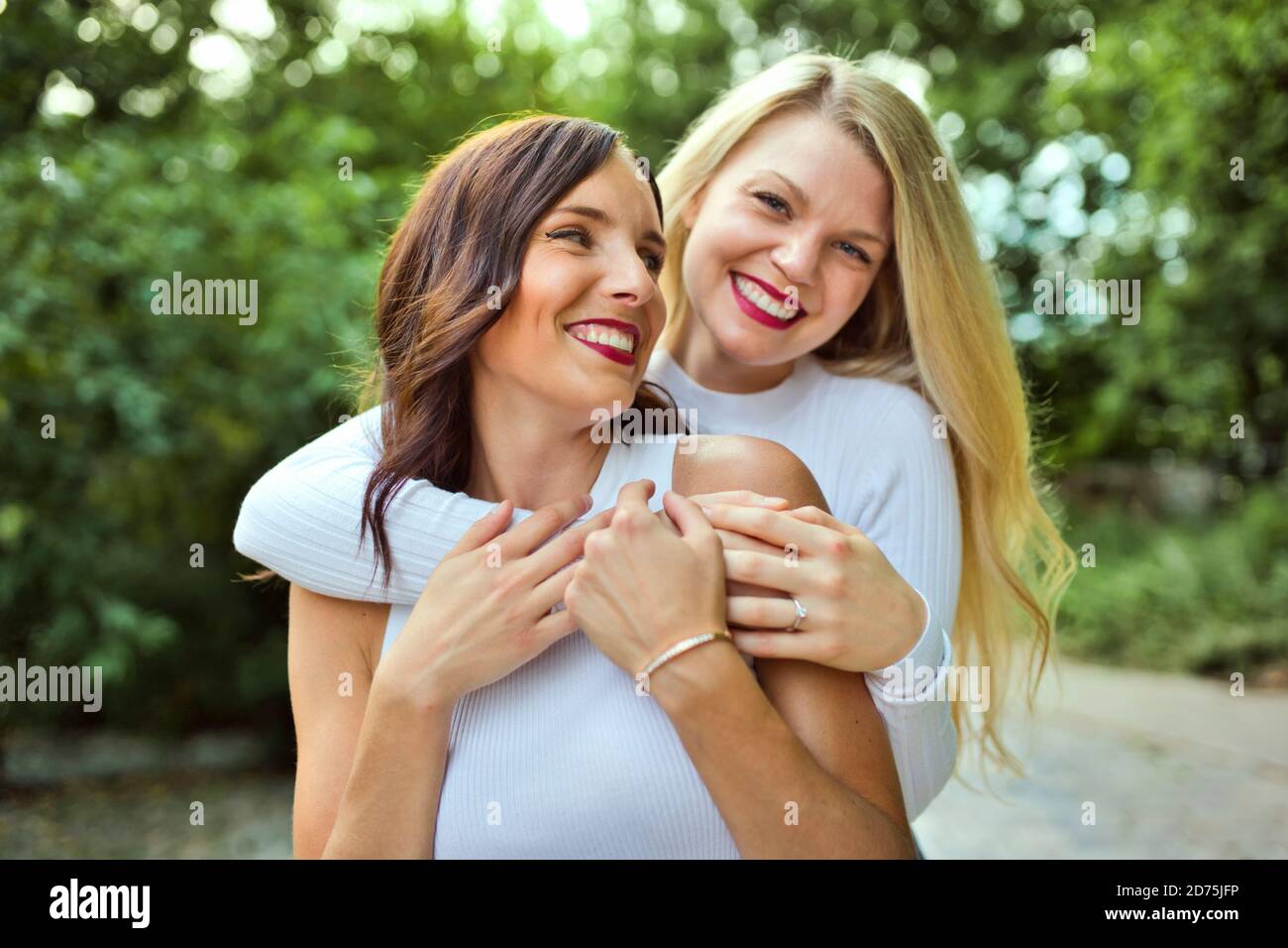 Two happy beautiful girls having fun outdoor Stock Photo - Alamy