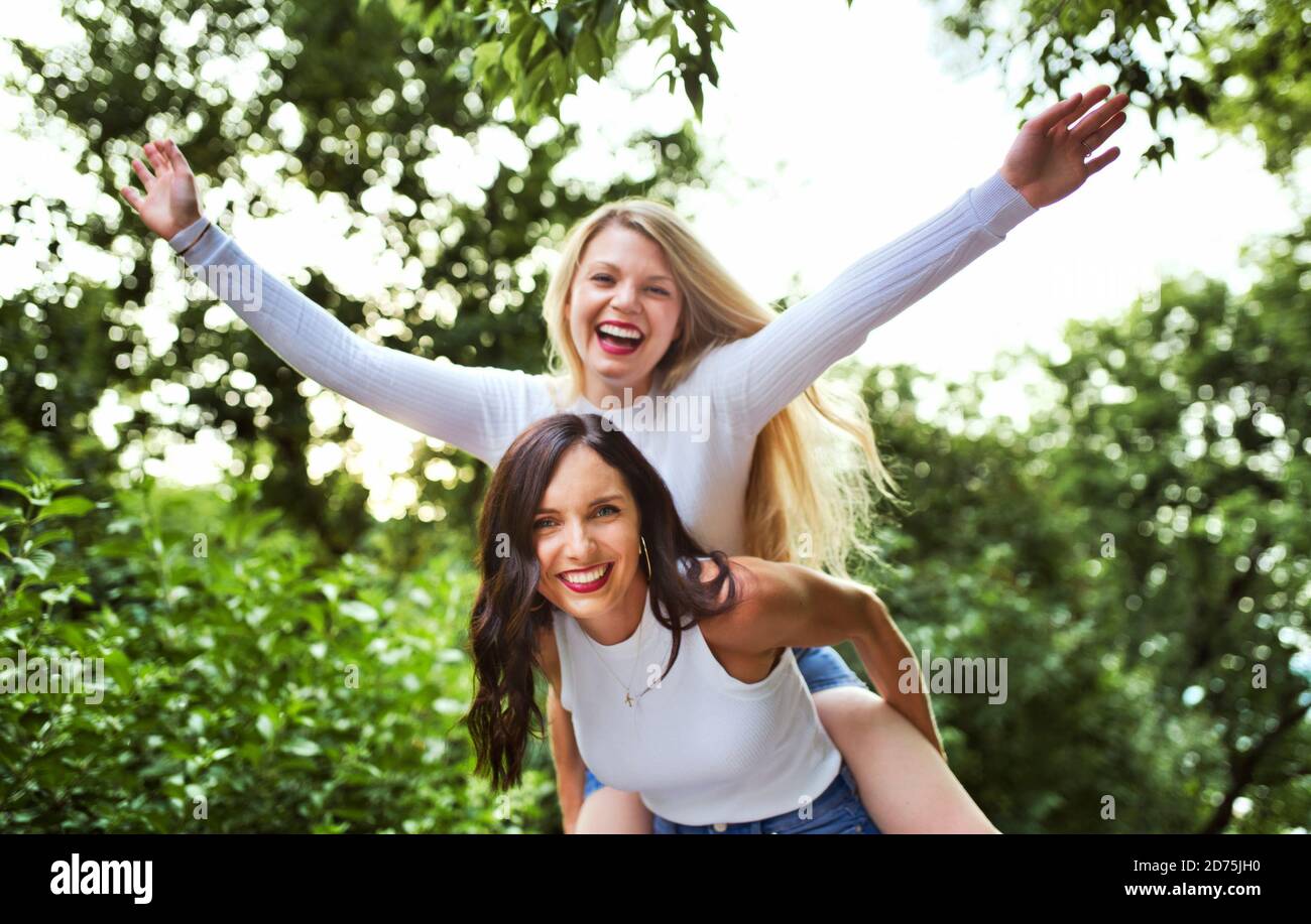 Two happy beautiful girls having fun outdoor Stock Photo - Alamy