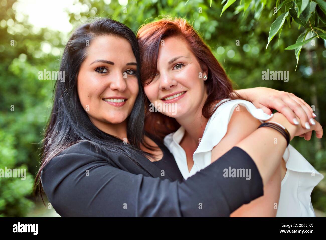 Two happy beautiful girls having fun outdoor Stock Photo - Alamy
