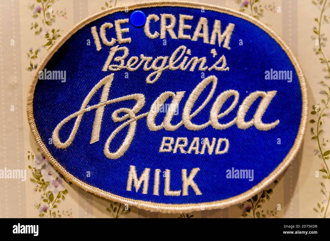 An old uniform patch advertises Berglin’s Azalea brand milk and ice ...