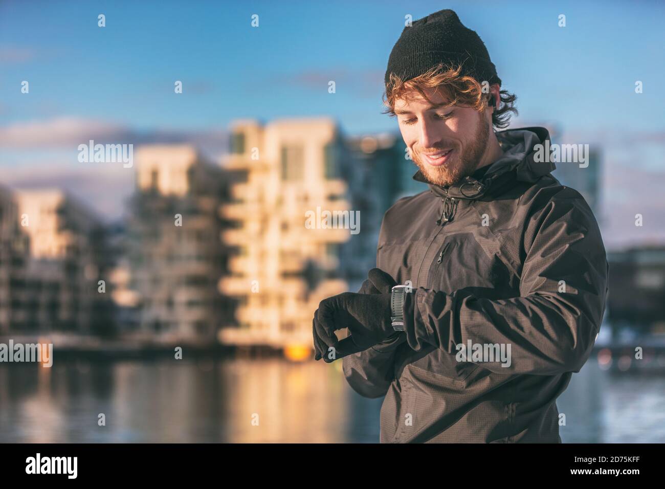 Smartwatch runner athlete man looking at his wearable technology smart ...