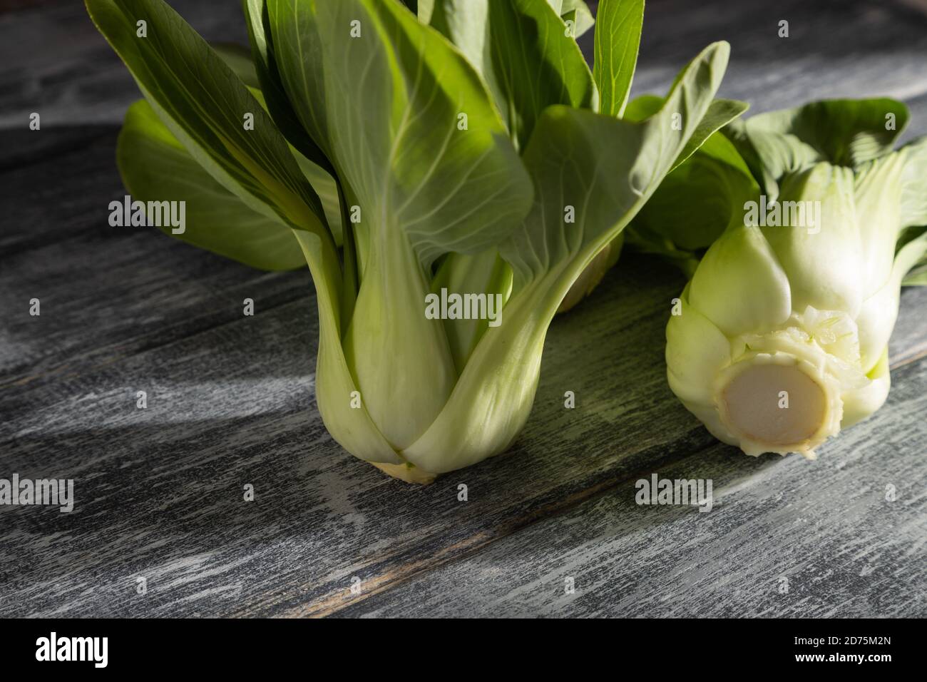 Fresh green bok choy or pac choi chinese cabbage on a gray wooden ...