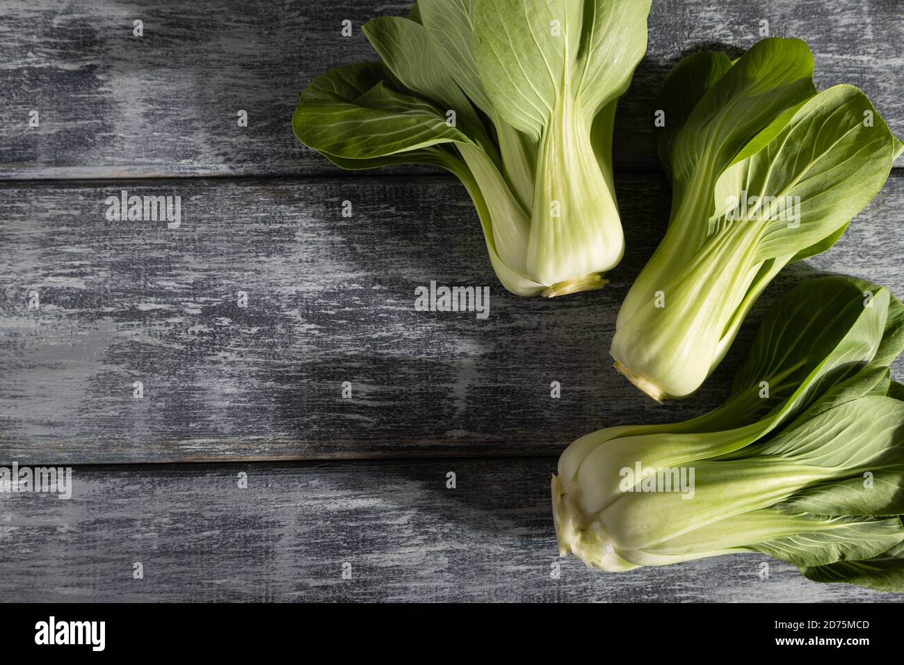 Fresh green bok choy or pac choi chinese cabbage on a gray wooden ...