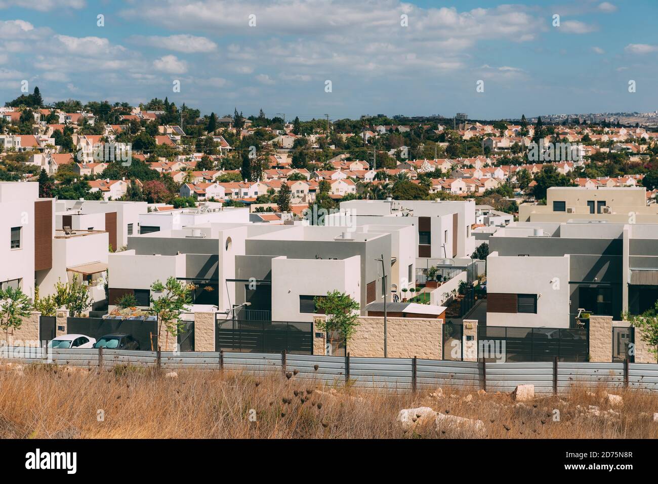 Many residential villas against the backdrop of houses in Israel, with ...