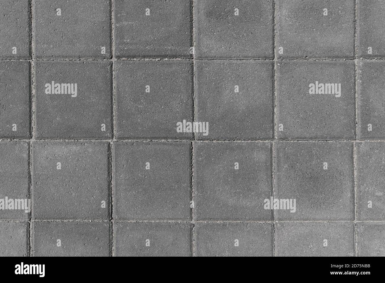 Closeup view of grey wall square tiles background on the public pave ...