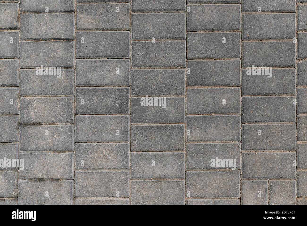 Closeup view of grey wall rectangle tiles background on the public pave ...