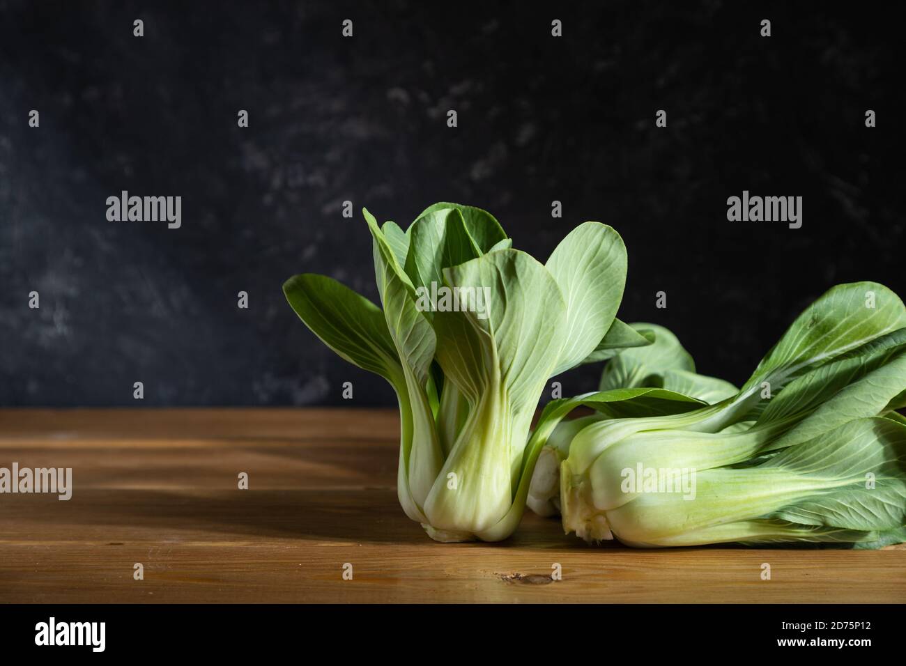 Fresh green bok choy or pac choi chinese cabbage on a gray wooden ...