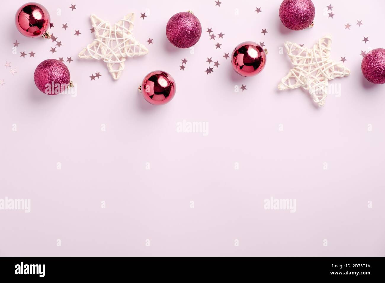 Christmas frame border of balls decoration, stars, confetti on pastel ...