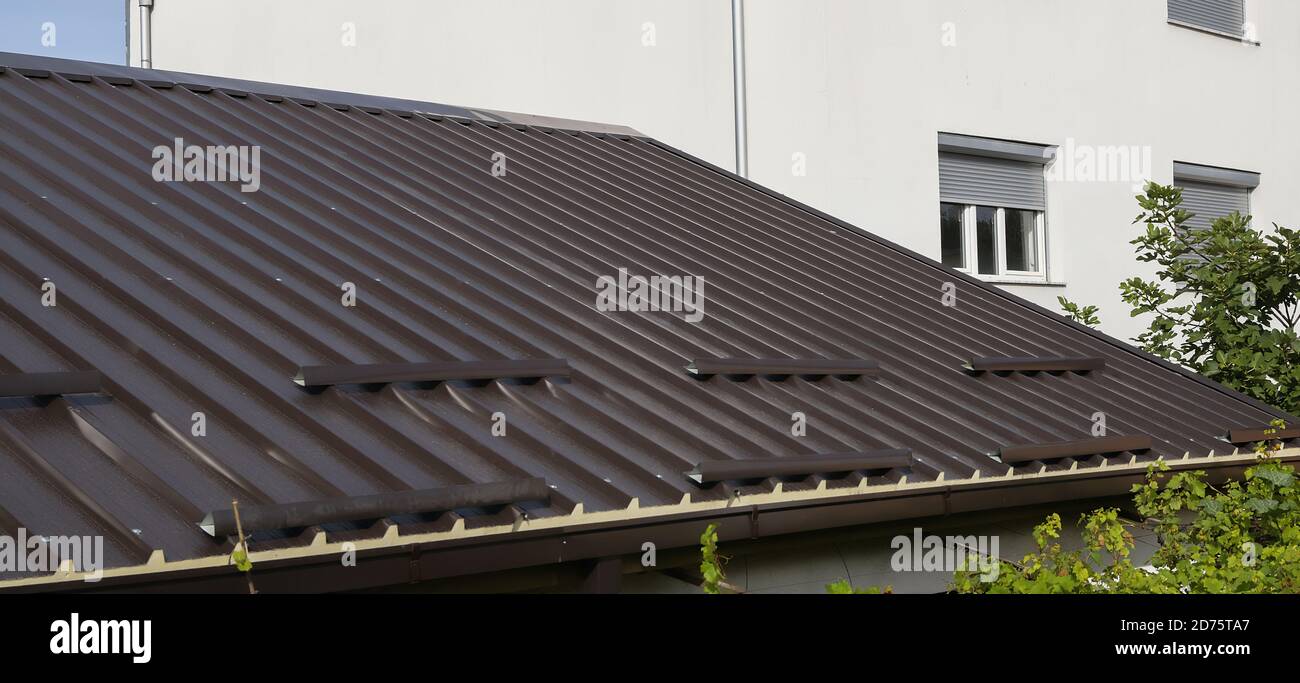 Modern house covered with brown tin panels Stock Photo - Alamy