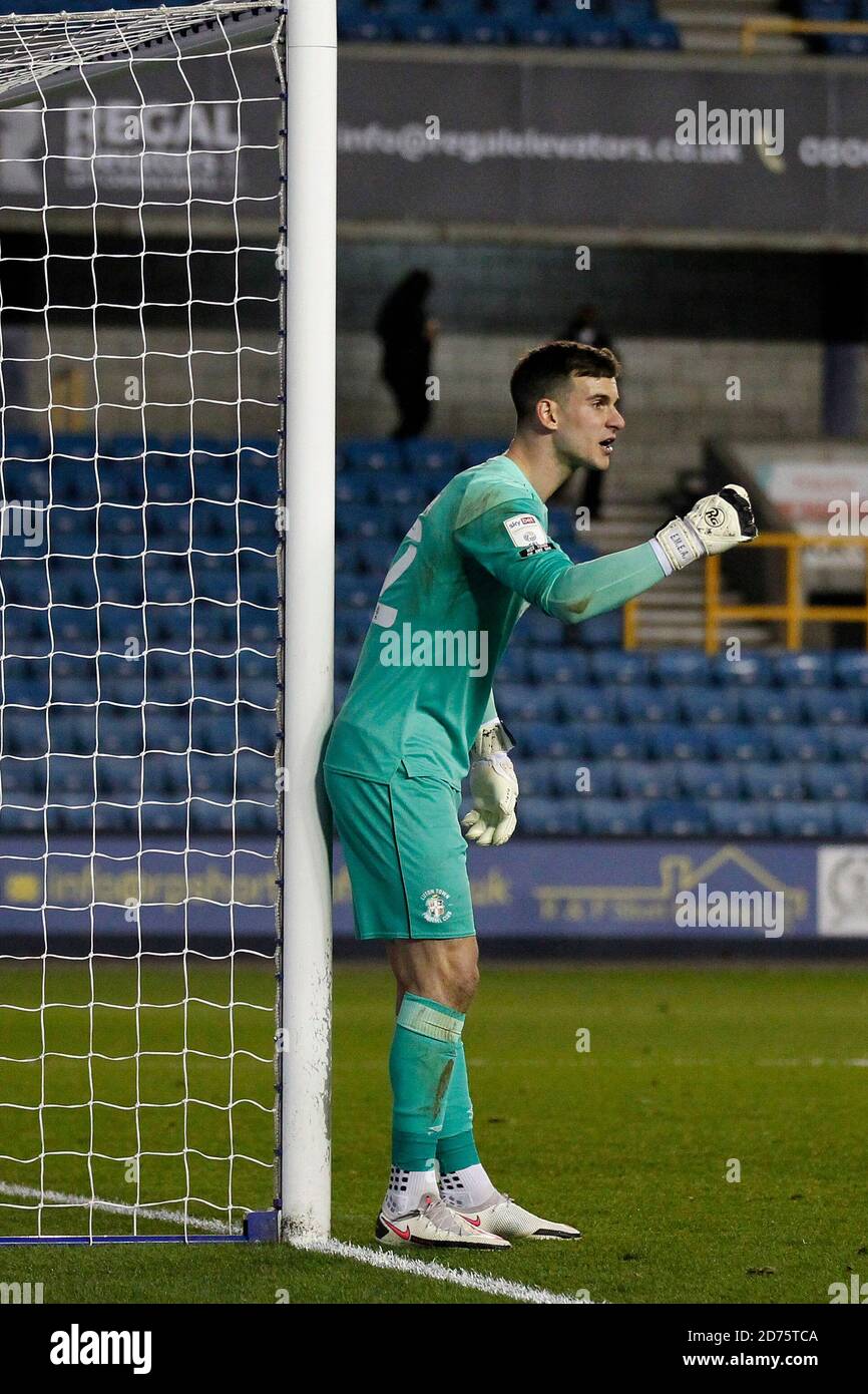 London, UK. 20th Oct, 2020. Simon Sluga of Luton Town organises his ...