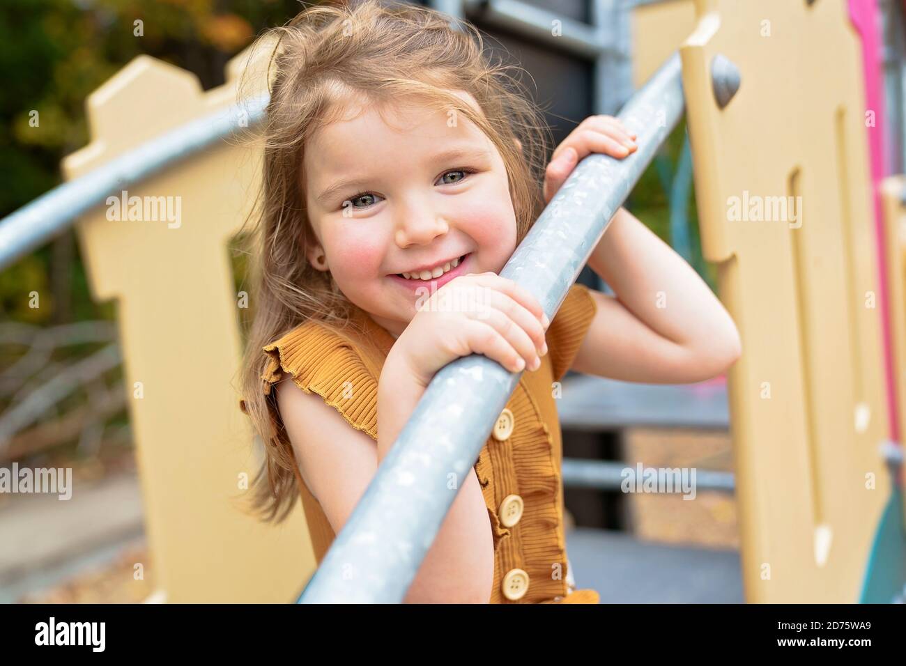 Happy Smiling Child Girl Playing At Playground Outdoors In a nice Park ...