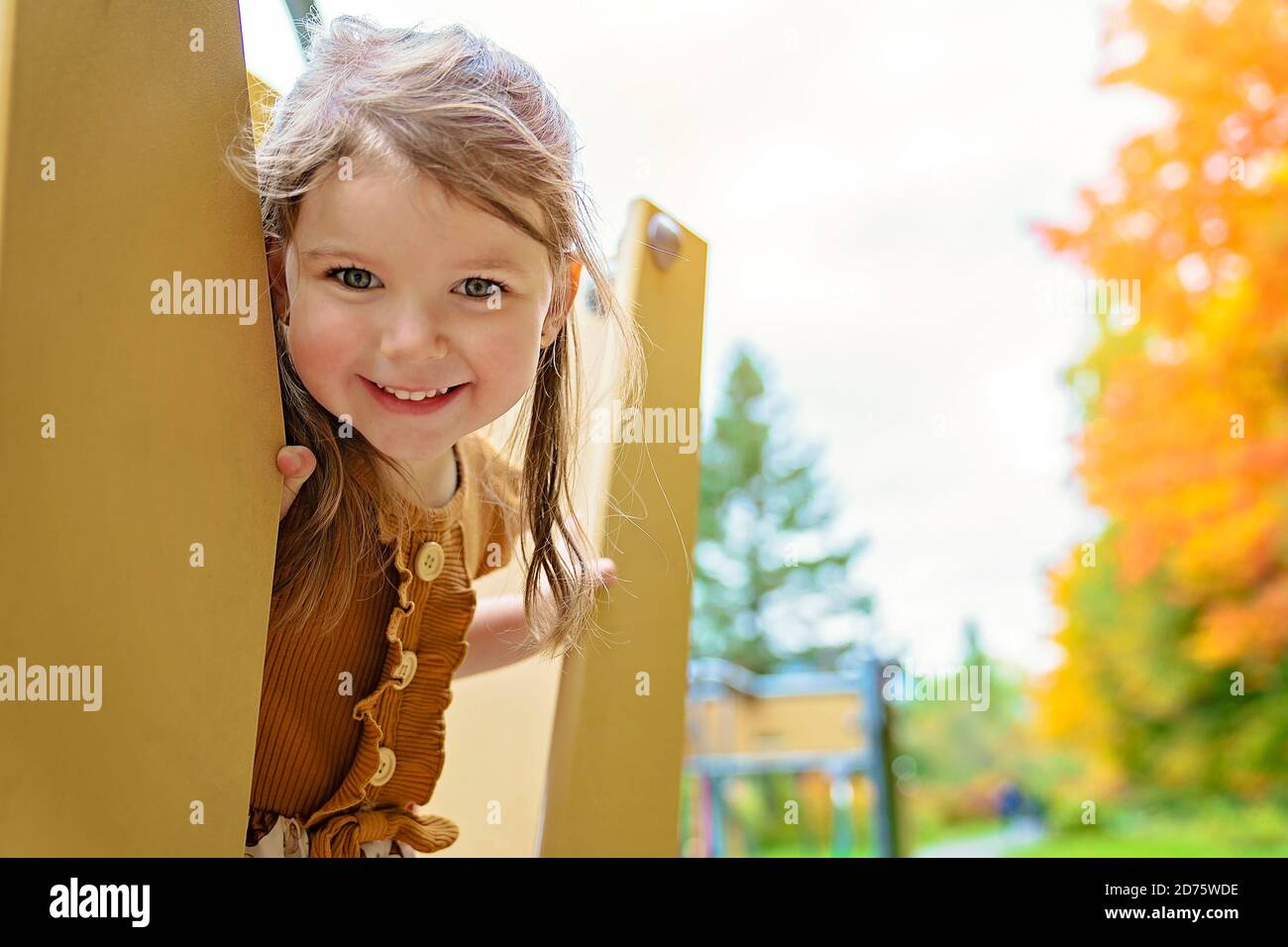 Happy Smiling Child Girl Playing At Playground Outdoors In a nice Park ...