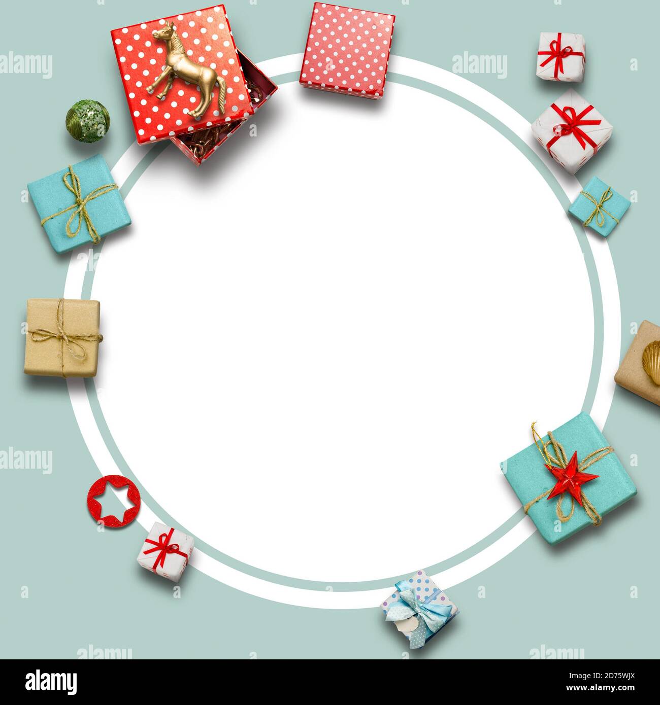 Christmas round frame holiday, surrounded by wrapped gifts on a light ...