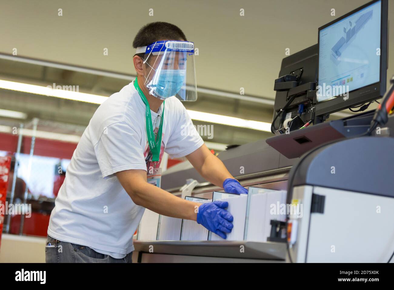 Renton, Washington, USA. 20th October, 2020. An election worker loads ...