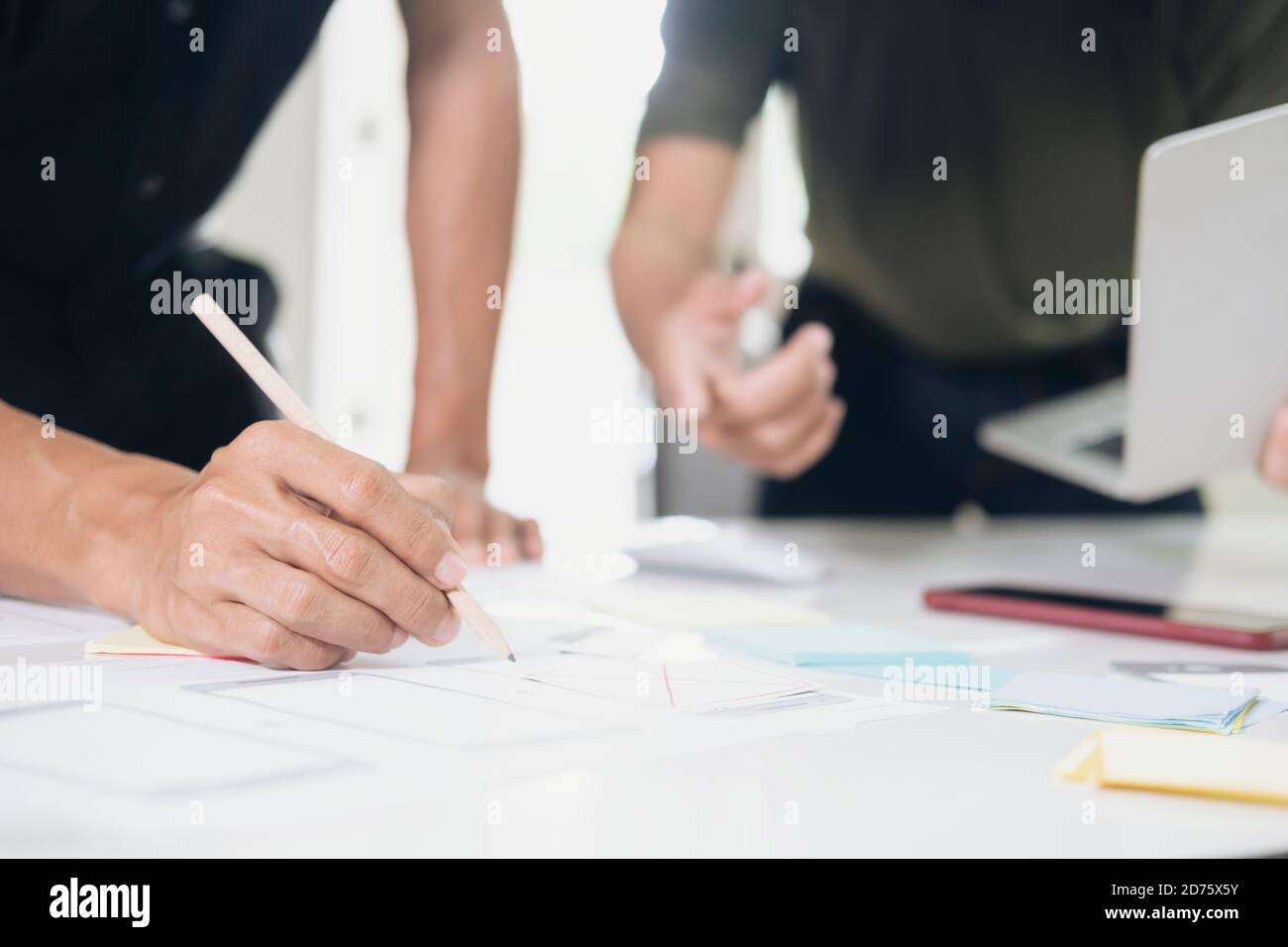 Programmer and UX UI designer working in a software development and ...