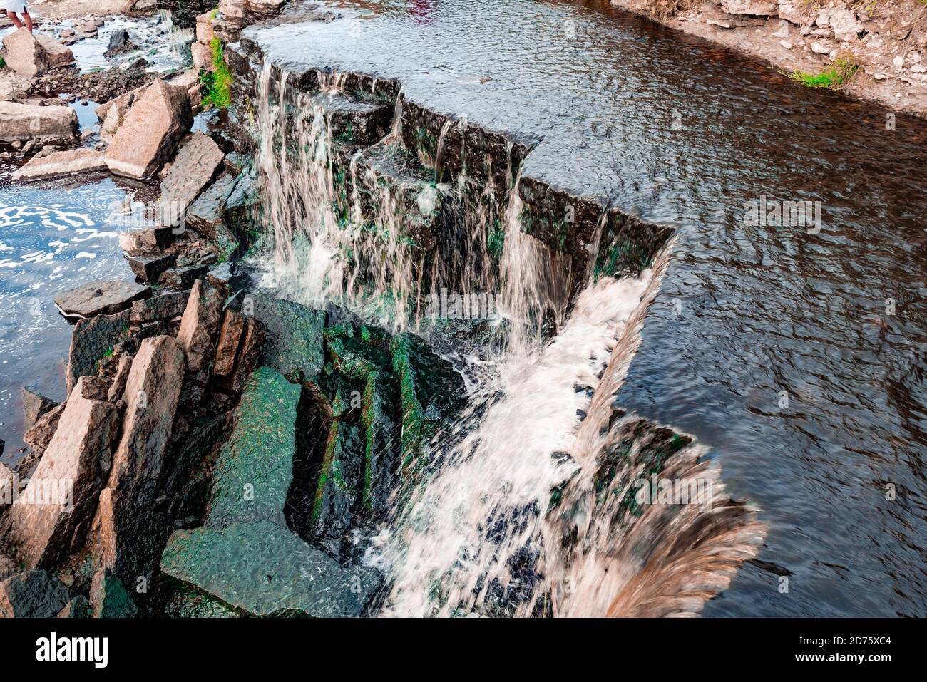 A bunch of rocks in the running water Stock Photo - Alamy