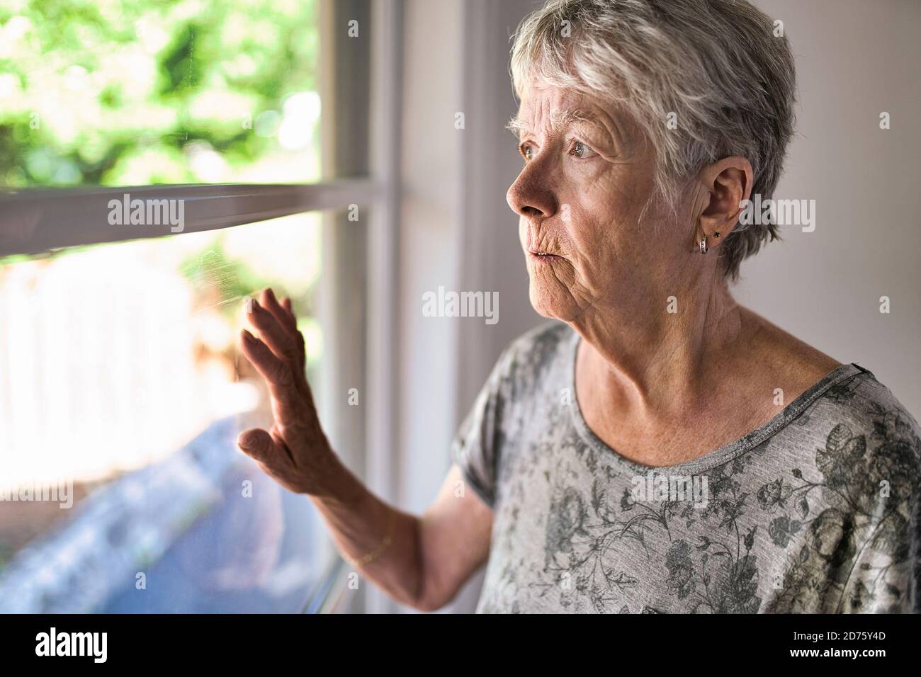 Woman house window worried hi-res stock photography and images - Alamy
