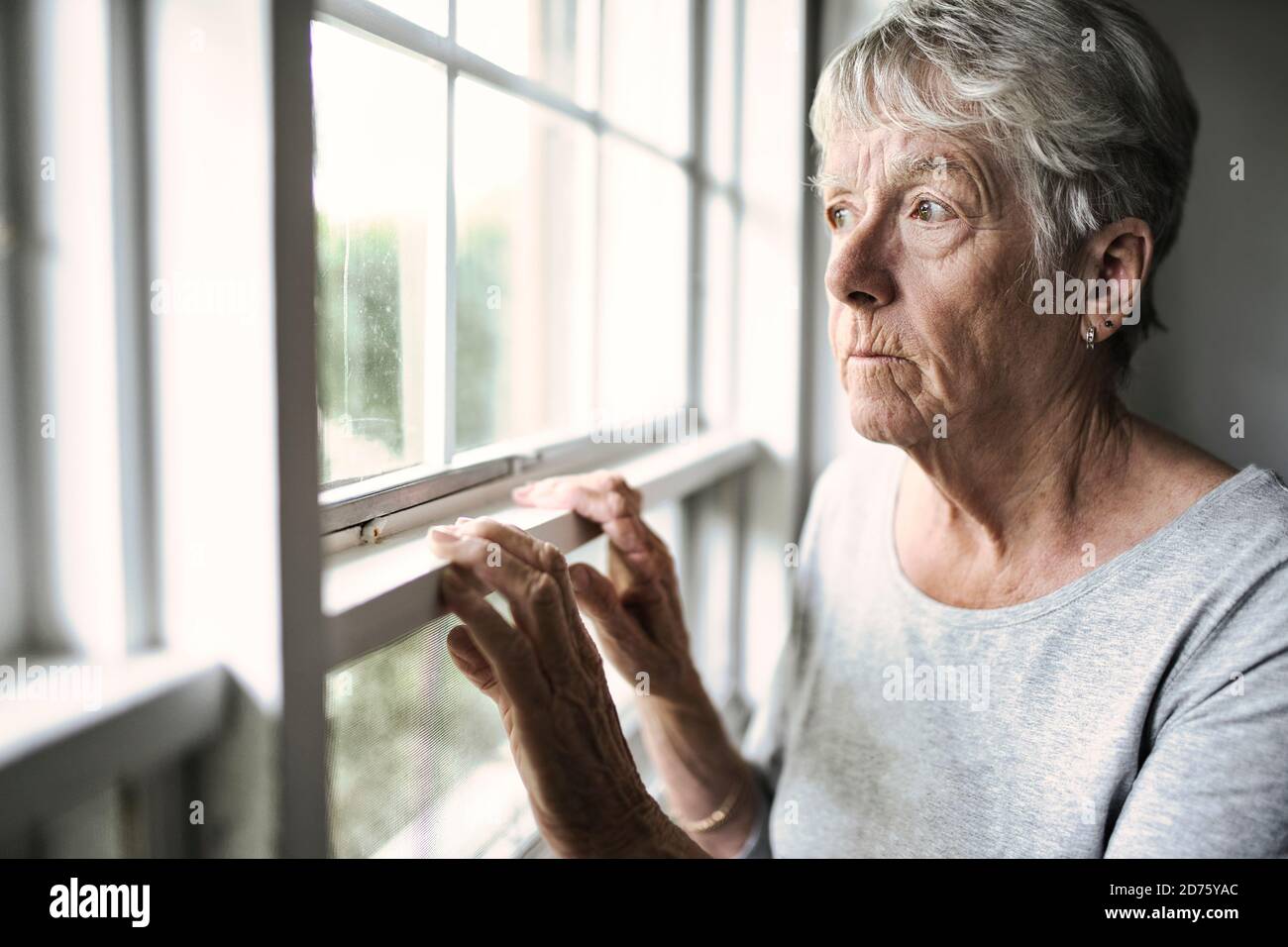 A worried senior woman at home felling very bad Stock Photo - Alamy