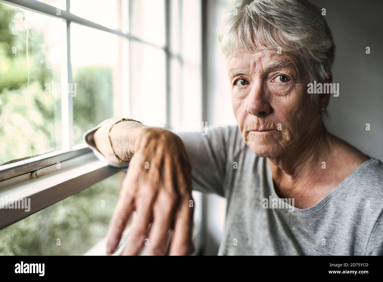 A worried senior woman at home felling very bad Stock Photo - Alamy