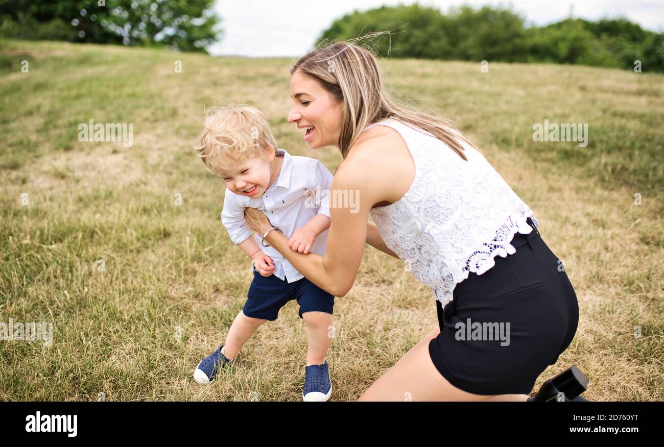 Happiness mother with her baby son on the day time Stock Photo - Alamy