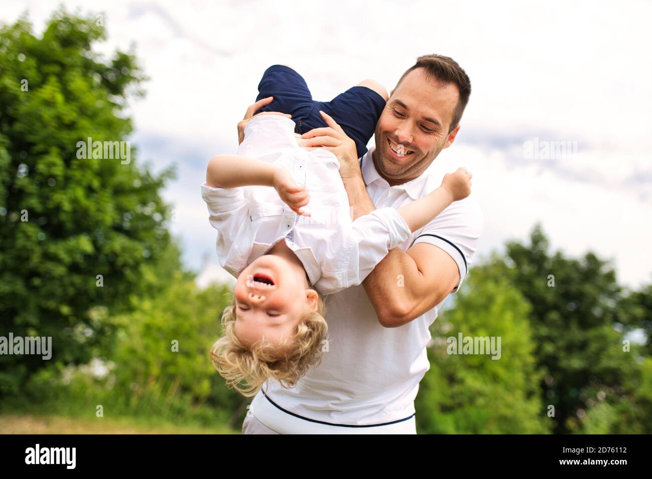 father and his cute baby boy having fun outdoors Stock Photo - Alamy