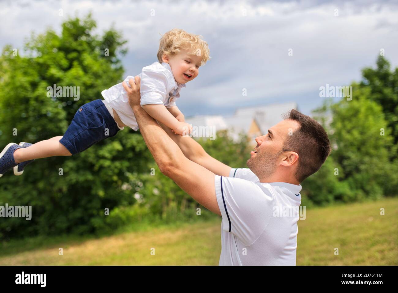 father and his cute baby boy having fun outdoors Stock Photo - Alamy