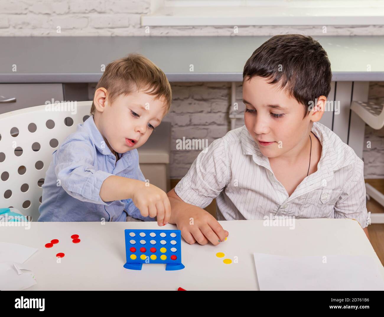The board game who will quickly collect 4 chips in a row Stock Photo ...