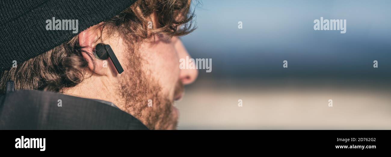 Wireless ear buds earbuds young man lifestyle banner panorama. Runner ...