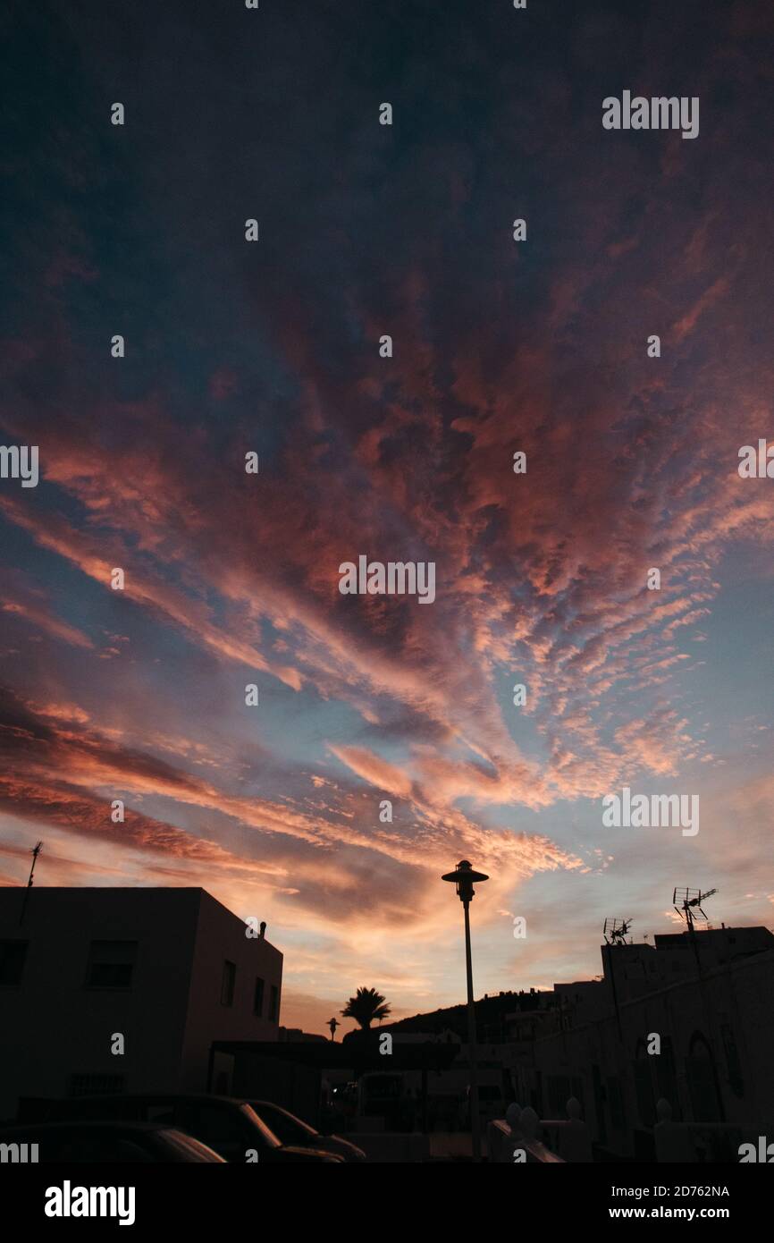 Beautiful scenery of the sunset sky over buildings Stock Photo - Alamy