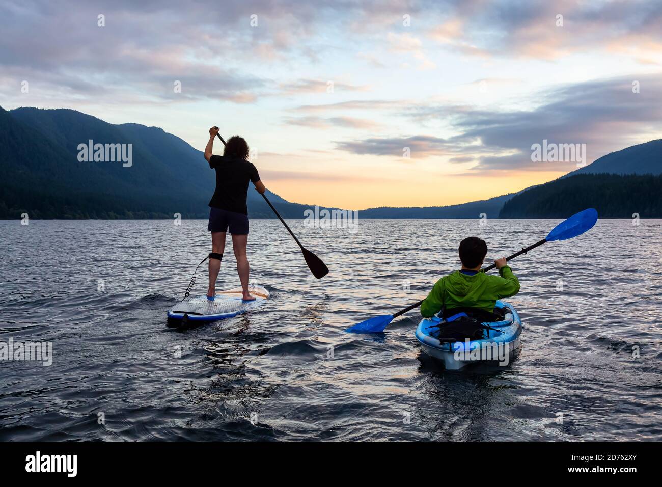 Friends on Scenic Lake Kayaking and Paddleboarding Together Stock Photo ...