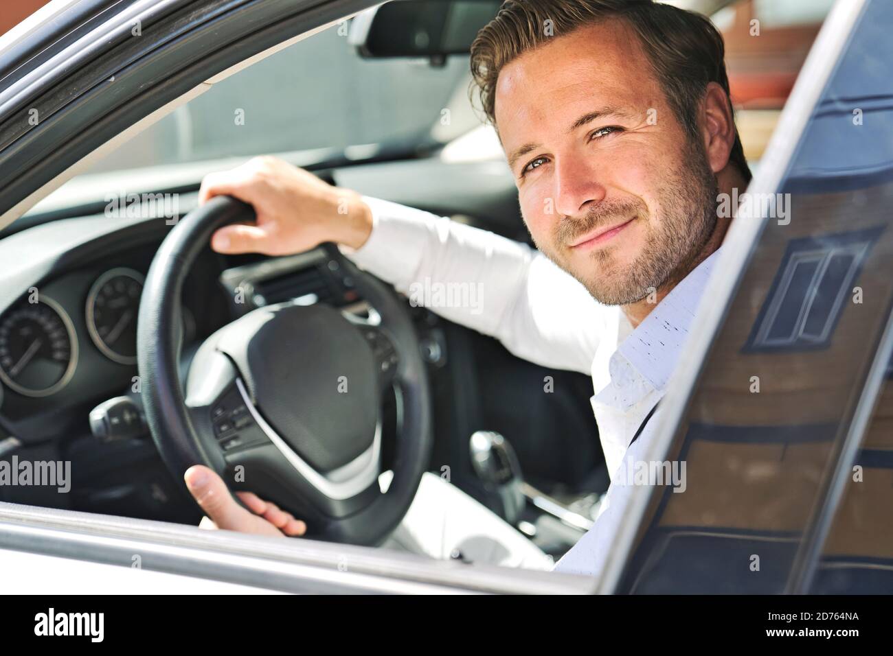 A Portrait of man on his car look nice Stock Photo - Alamy