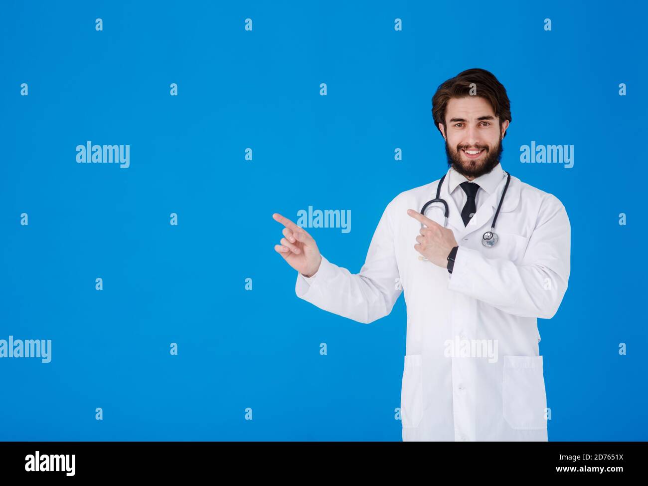 Horizontal banner of smiling young male doctor showing and presenting ...