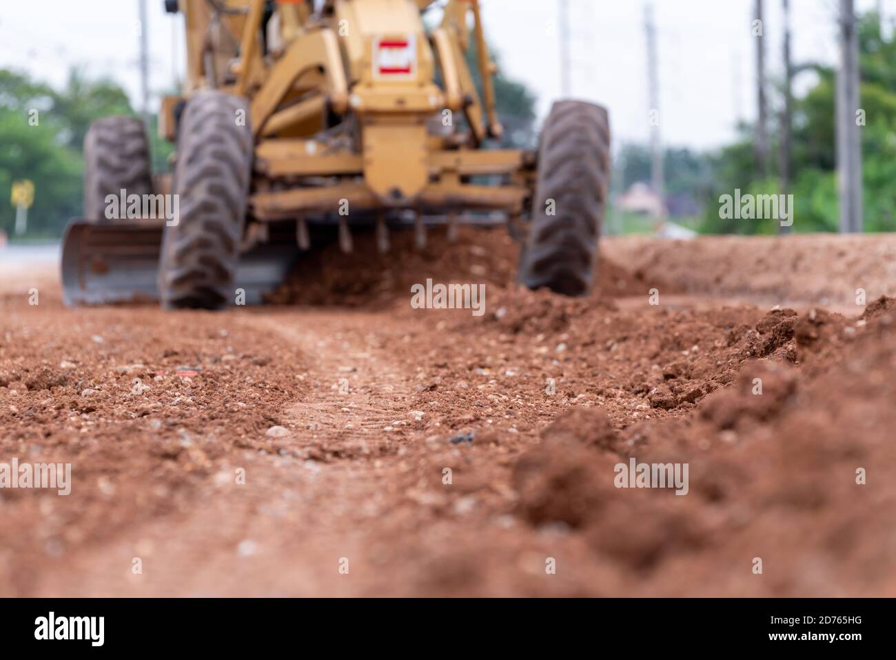 Blurred Motor Grader Civil road construction improvement base road work ...