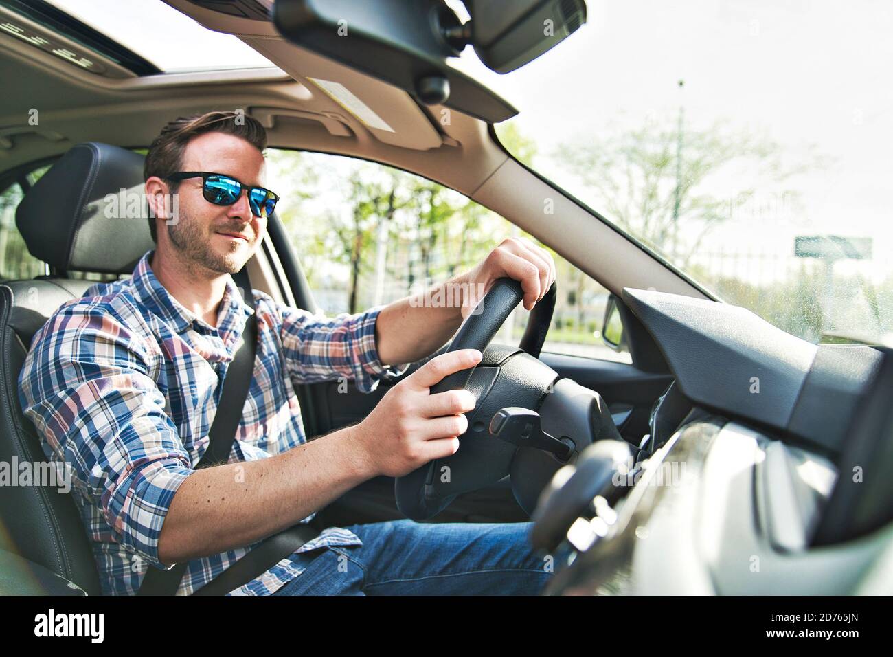 A Portrait of man on his car look nice Stock Photo - Alamy