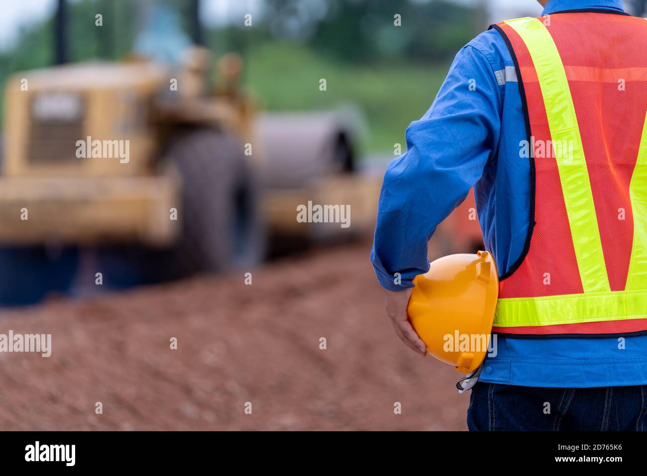 Close up Civil engineer holding helmet in road construction site ...