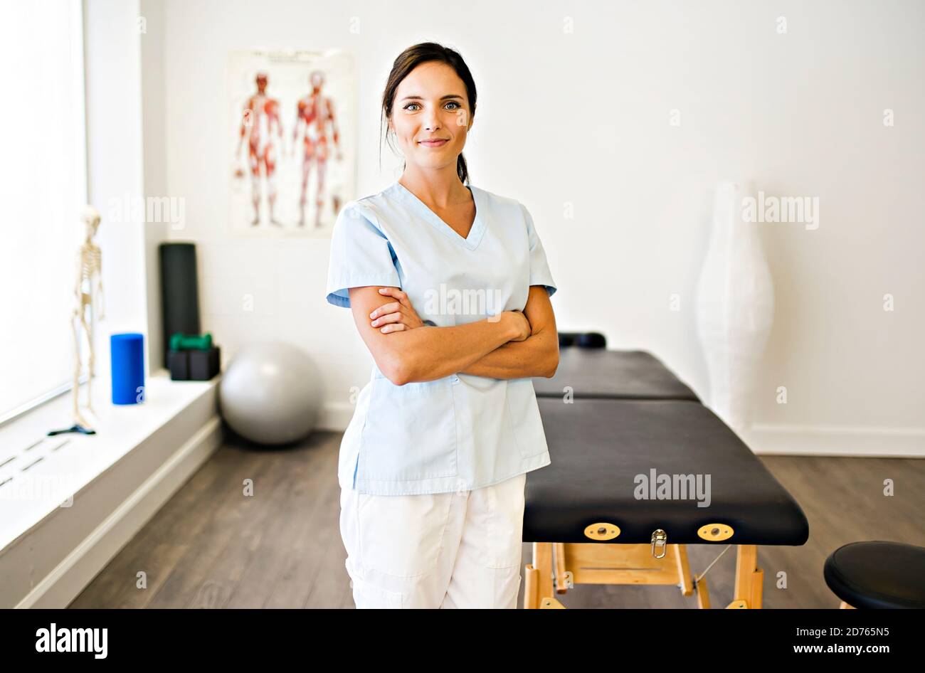 Portrait of a physiotherapy woman smiling in uniforme Stock Photo - Alamy